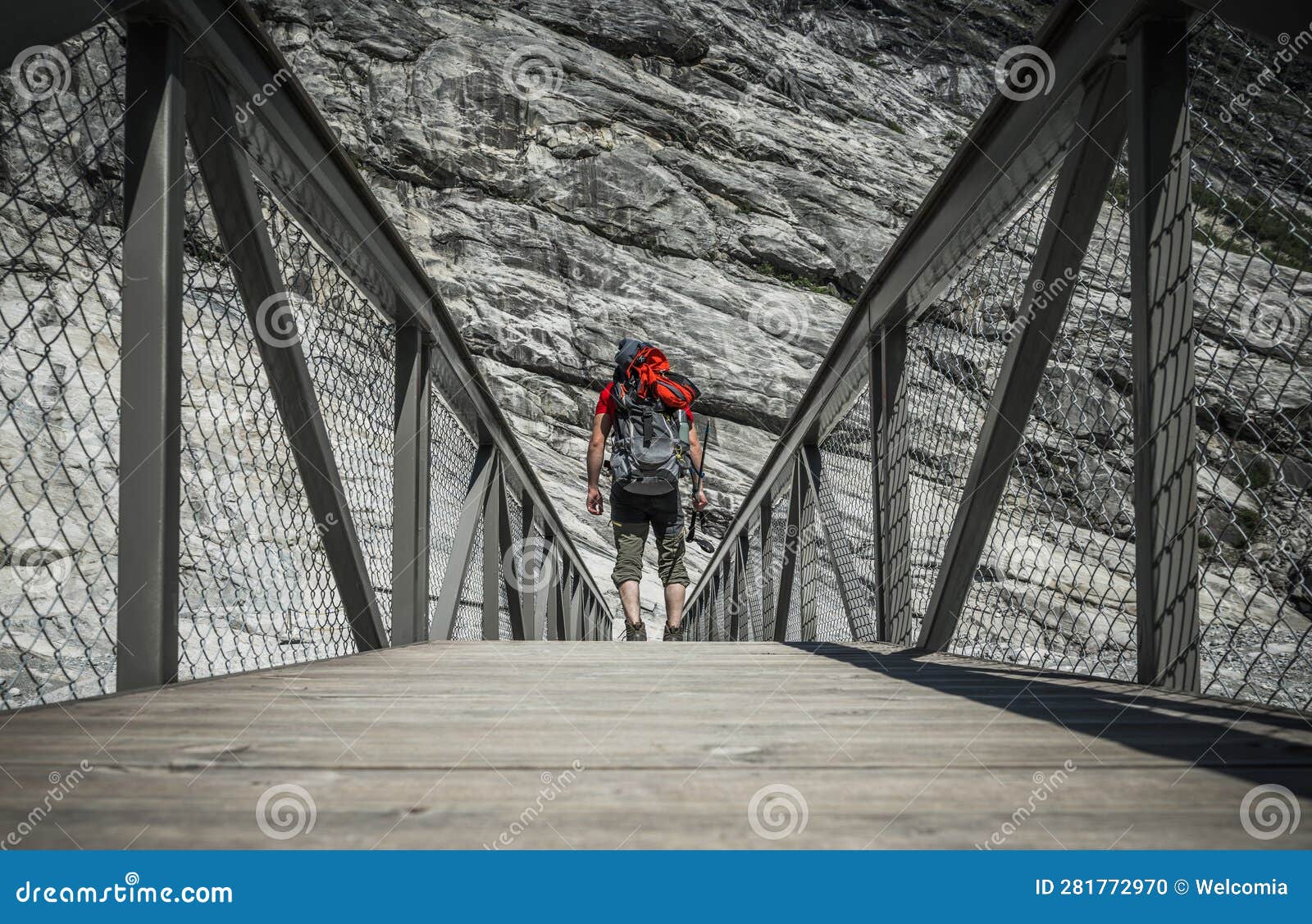 Hiker Crossing Mountain Trail Bridge Stock Photo - Image of sport ...