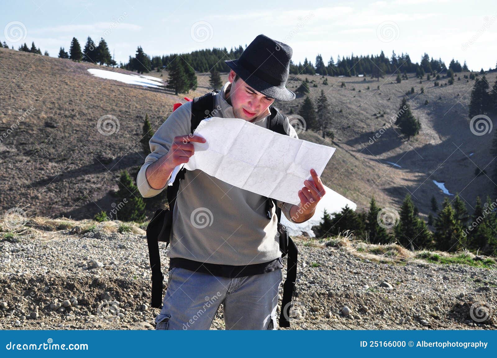 Hiker holding a map stock photo. Image of jacket, adventure - 25166000