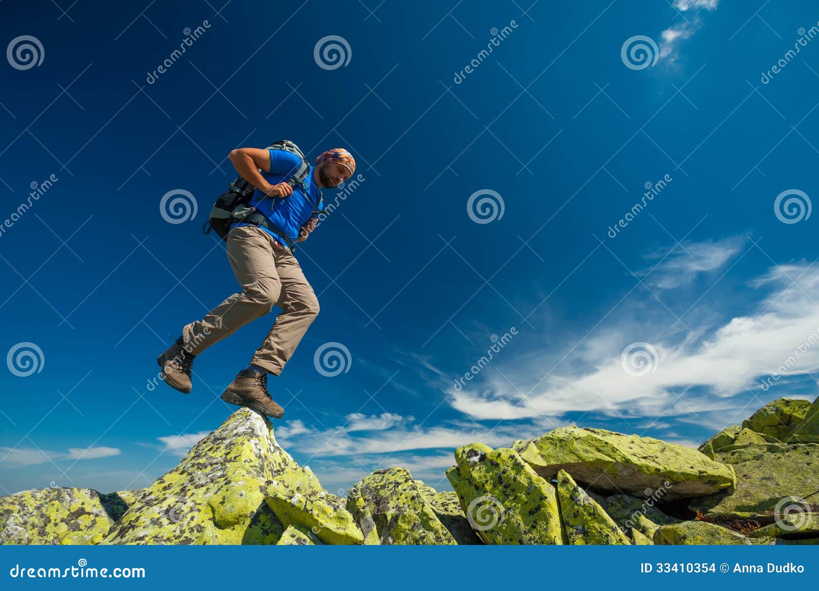 Hiker jumps over stones stock photo. Image of climb, outdoors - 33410354