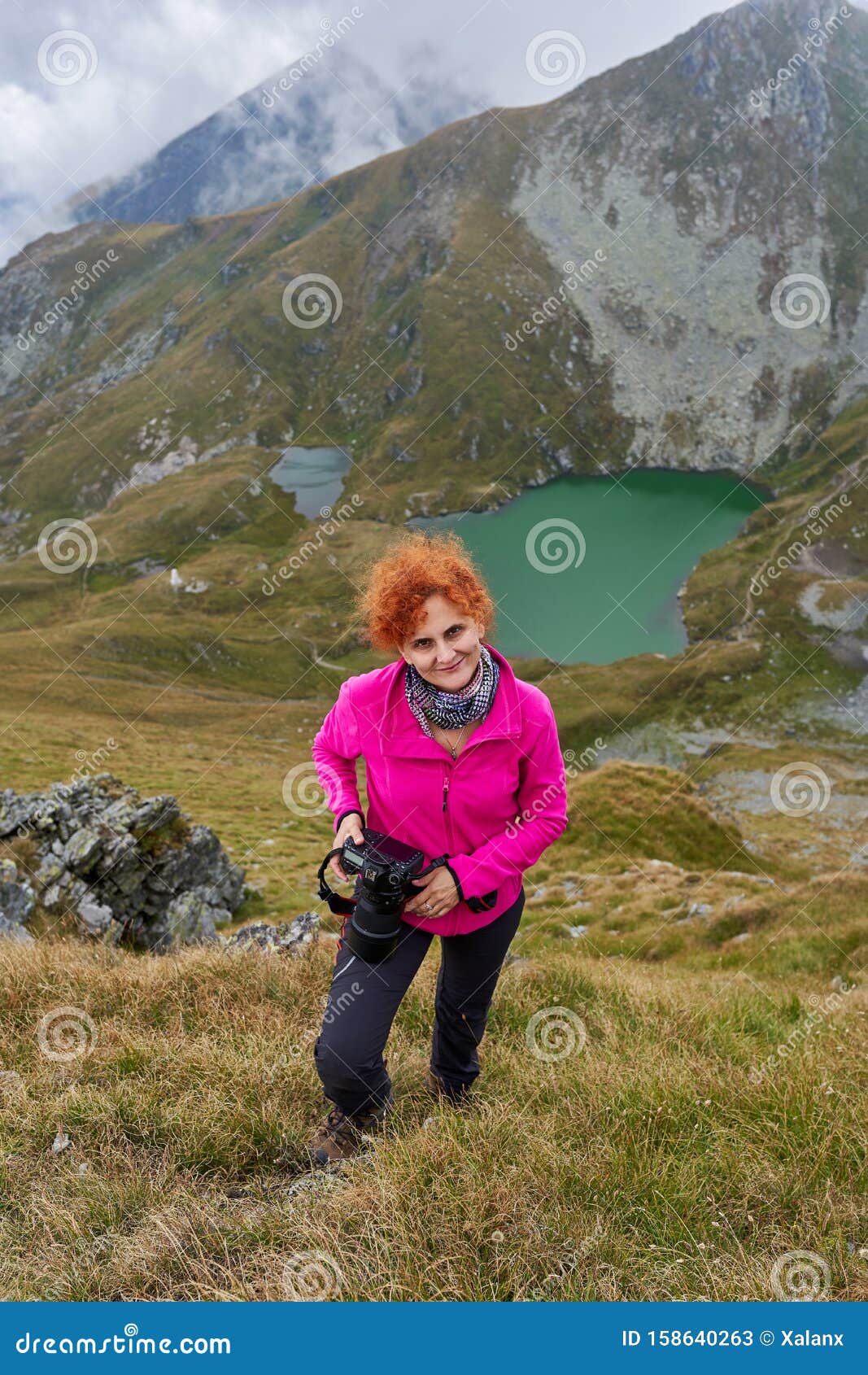 Hiker lady with camera stock image. Image of young, woman - 158640263