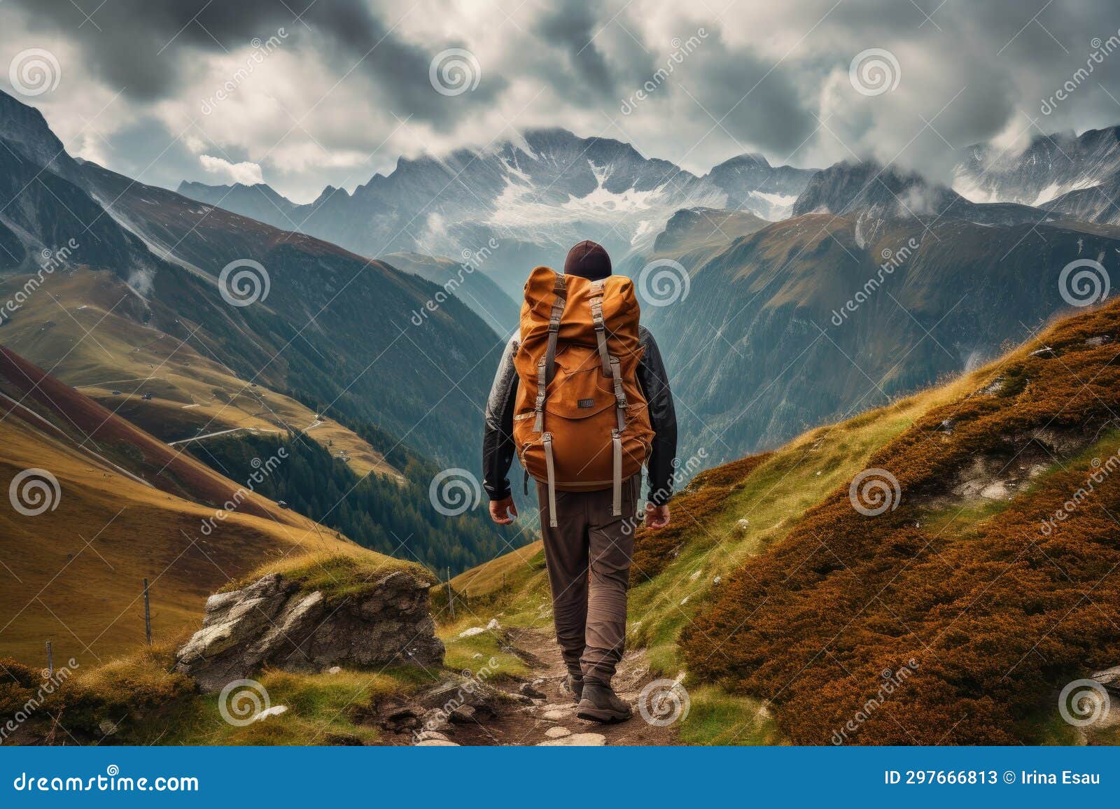 A Hiker with a Large Backpack on a Mountain Path with Dramatic Peaks in ...