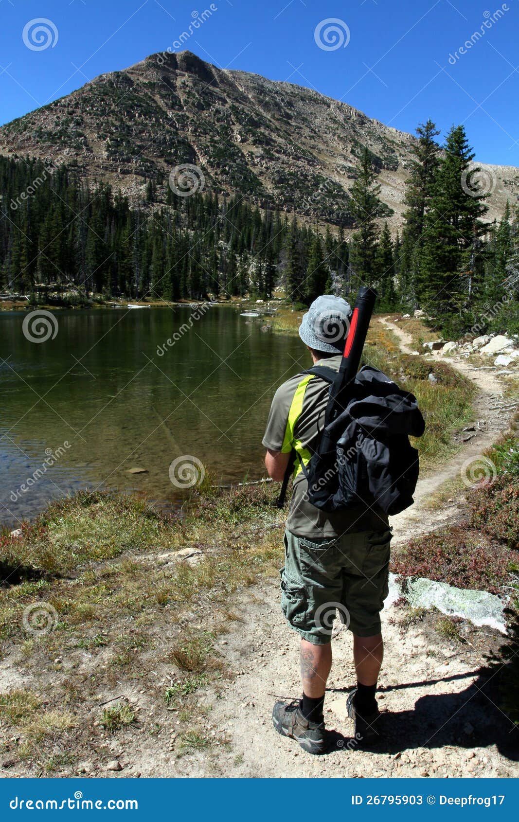 Hiker looking at mountains stock image. Image of aged - 26795903