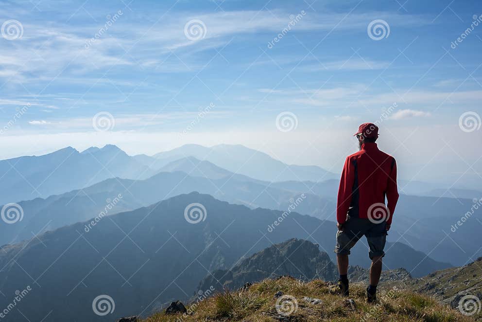 Hiker Looking Over the Mountain Ridges Stock Image - Image of ridges ...