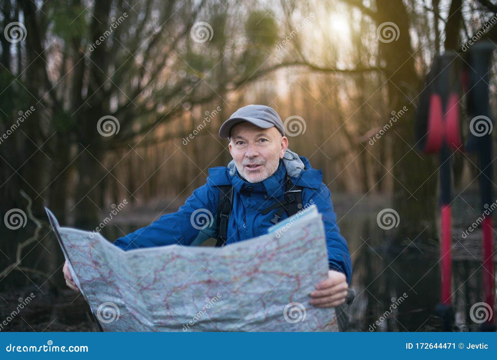 Hiker with map in forest stock image. Image of healthy - 172644471