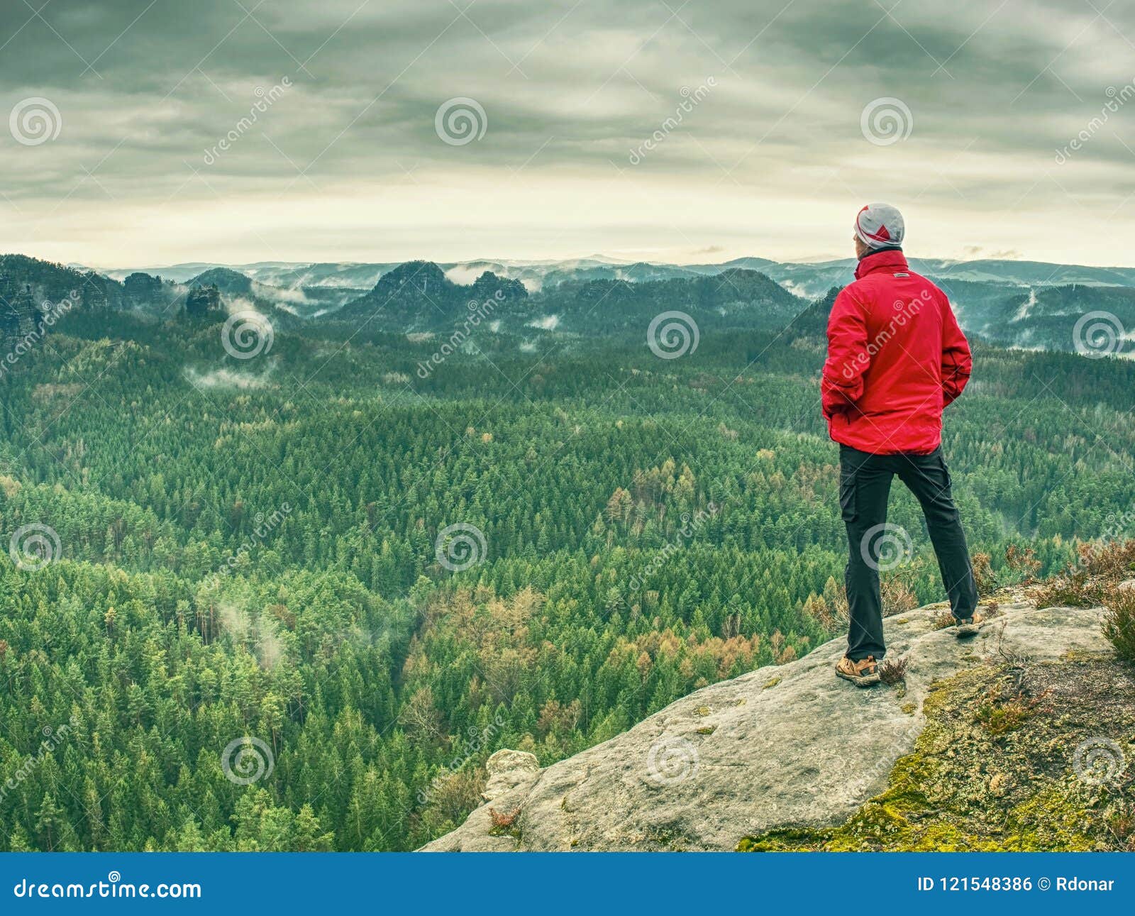 Hiker in Red Jacket Climbed Up To Peak Enjoy View. Mountain Climber ... Hiker in Red Jacket Climbed Up To Peak Enjoy View. Mountain Climber ...