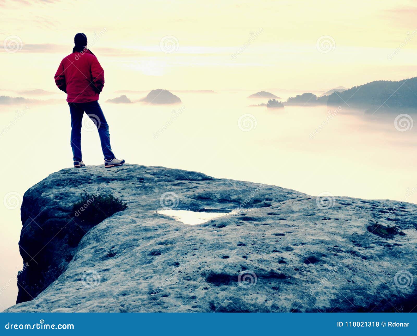 Hiker in Red Jacket Enjoy View Over Clouds. Mountain Rocky Peak Stock ... Hiker in Red Jacket Enjoy View Over Clouds. Mountain Rocky Peak Stock ...