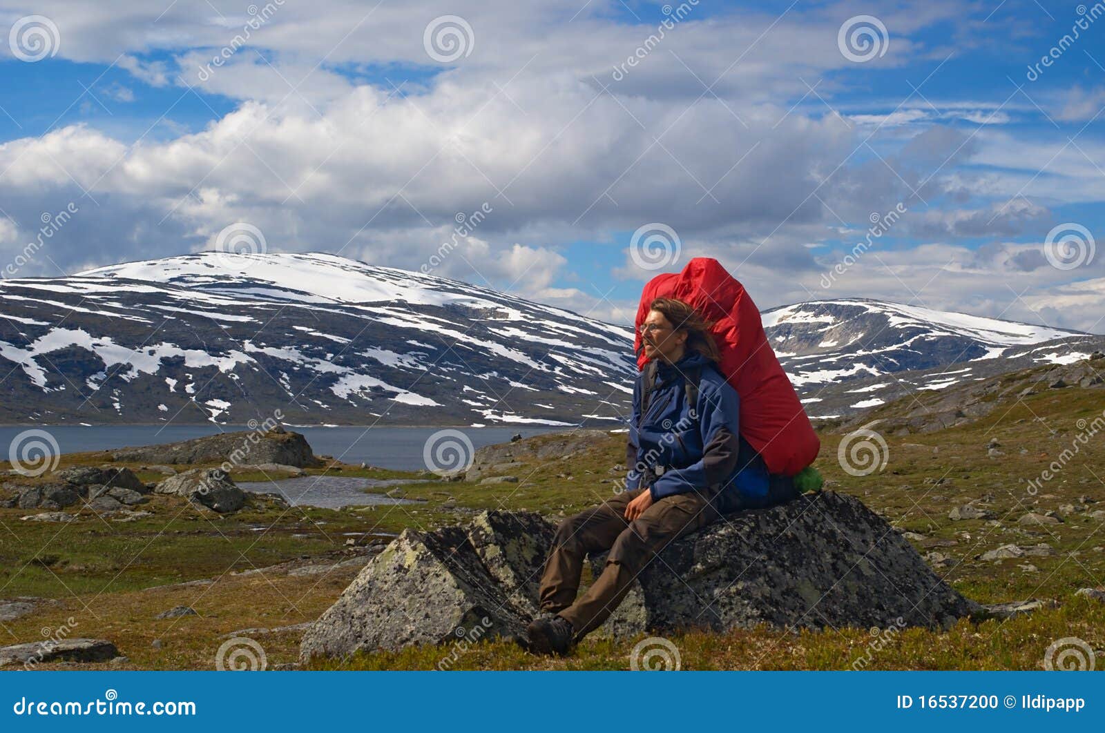 Hiker Resting on Rock stock photo. Image of range, mountain - 16537200