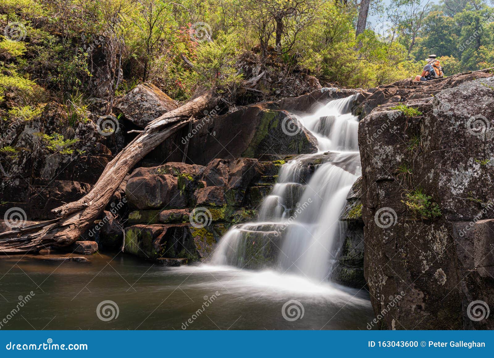 Hiker Resting on Top of Gloucester Falls with Low Flow Water Due To ...