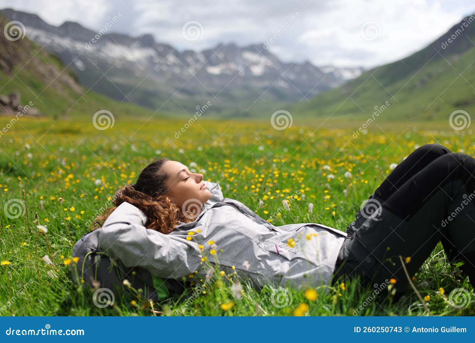 Hiker Resting in a Valley of a High Mountain Stock Image - Image of ...
