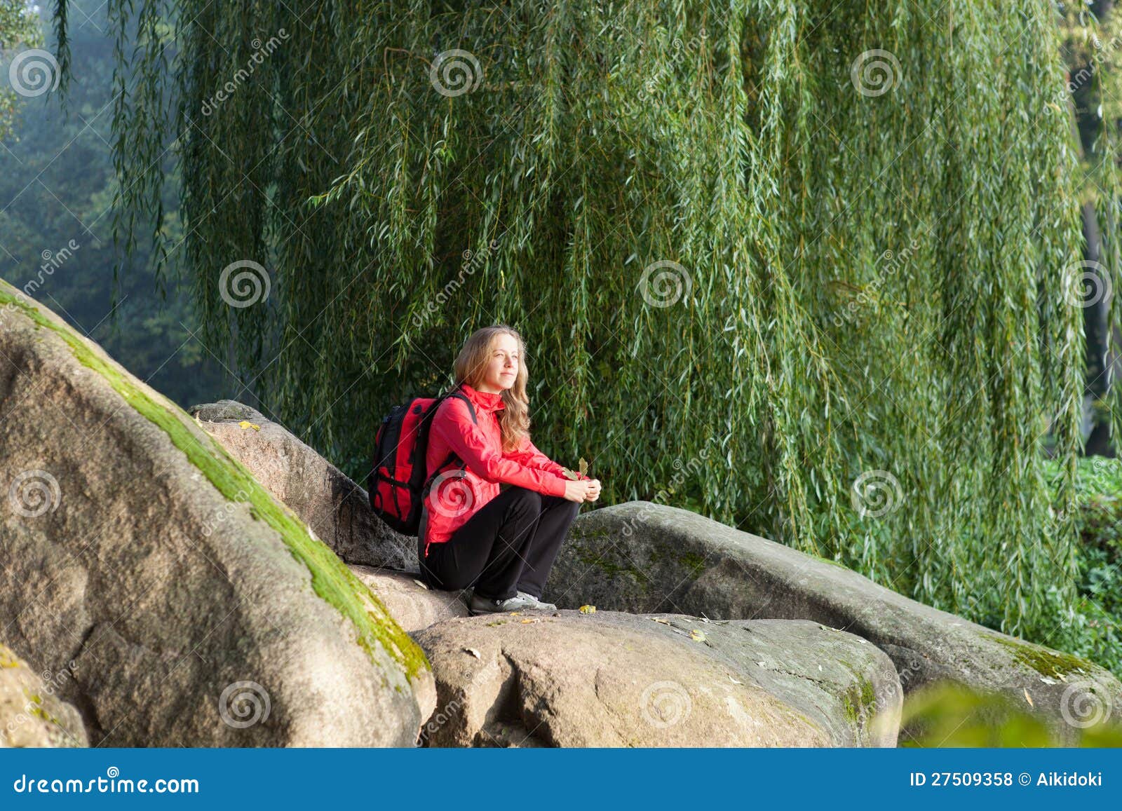 Hiker Sitting on a Halt in Rocks among the Nature Stock Photo - Image ...