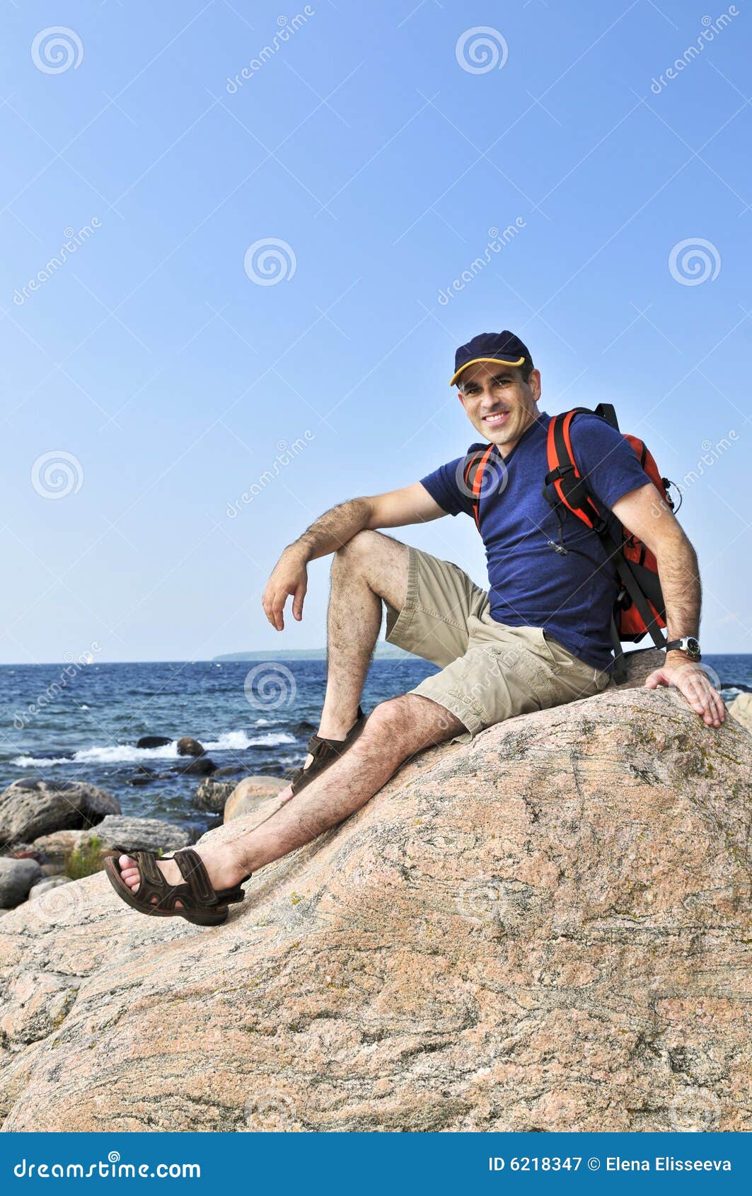 Hiker sitting on a rock stock image. Image of active, adult - 6218347