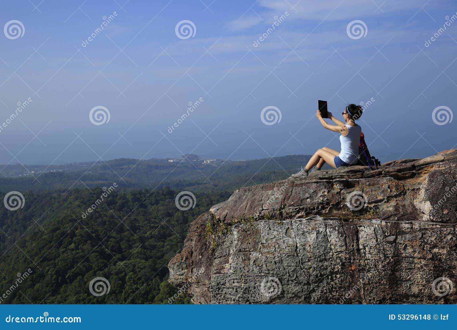 Hiker Use Digital Tablet at Mountain Peak Cliff Stock Photo - Image of ...