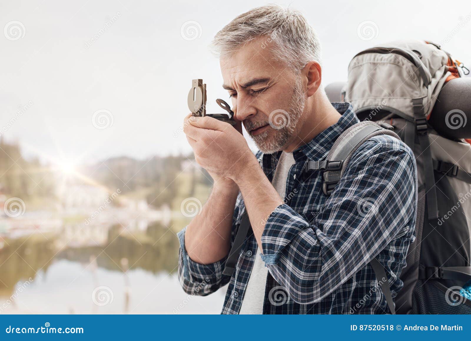Hiker using a compass stock photo. Image of magnetic - 87520518