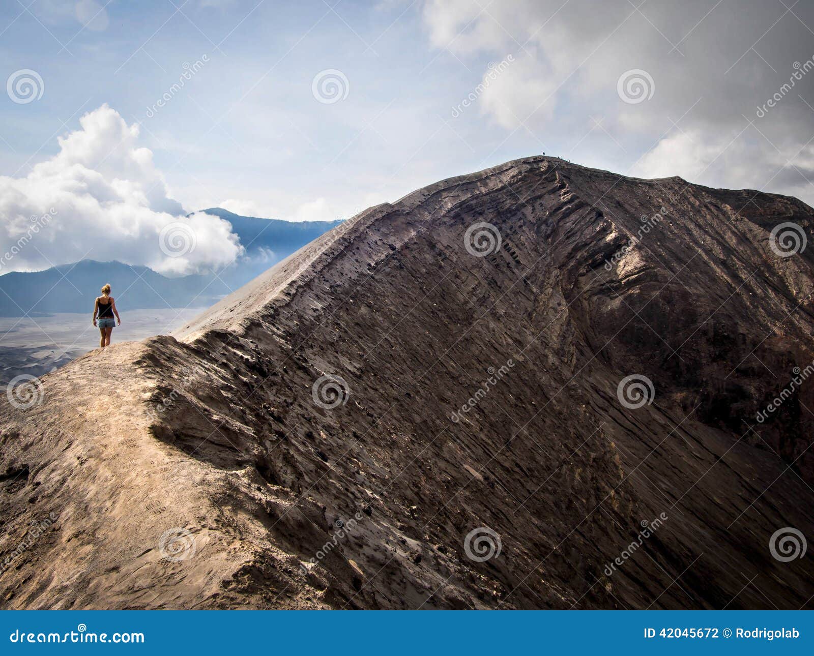 Hiker Walking Around Rim of Gunung Bromo Volcano, Java, Indonesia Stock ...