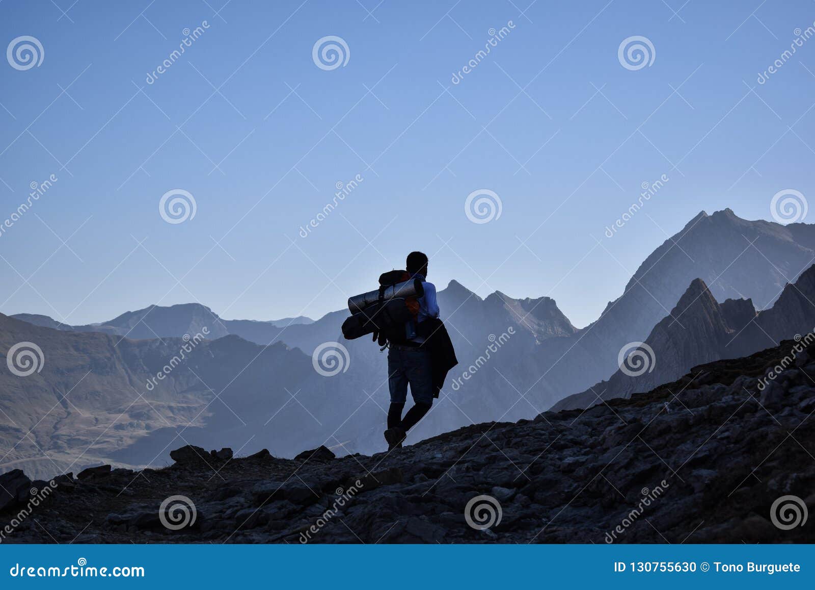 Hiker Walking on the Ridge of a Mountain Stock Photo - Image of amazing ...
