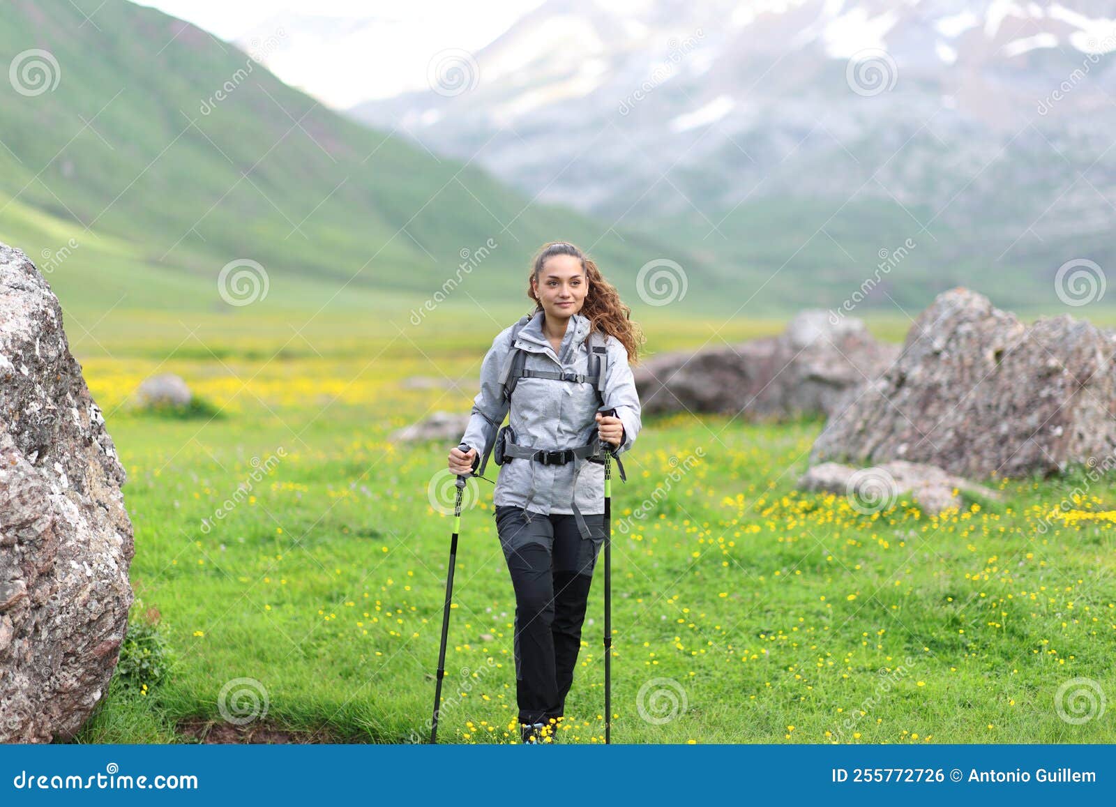 Hiker Walking Towards You in a Valley Stock Photo - Image of ecotourist ...