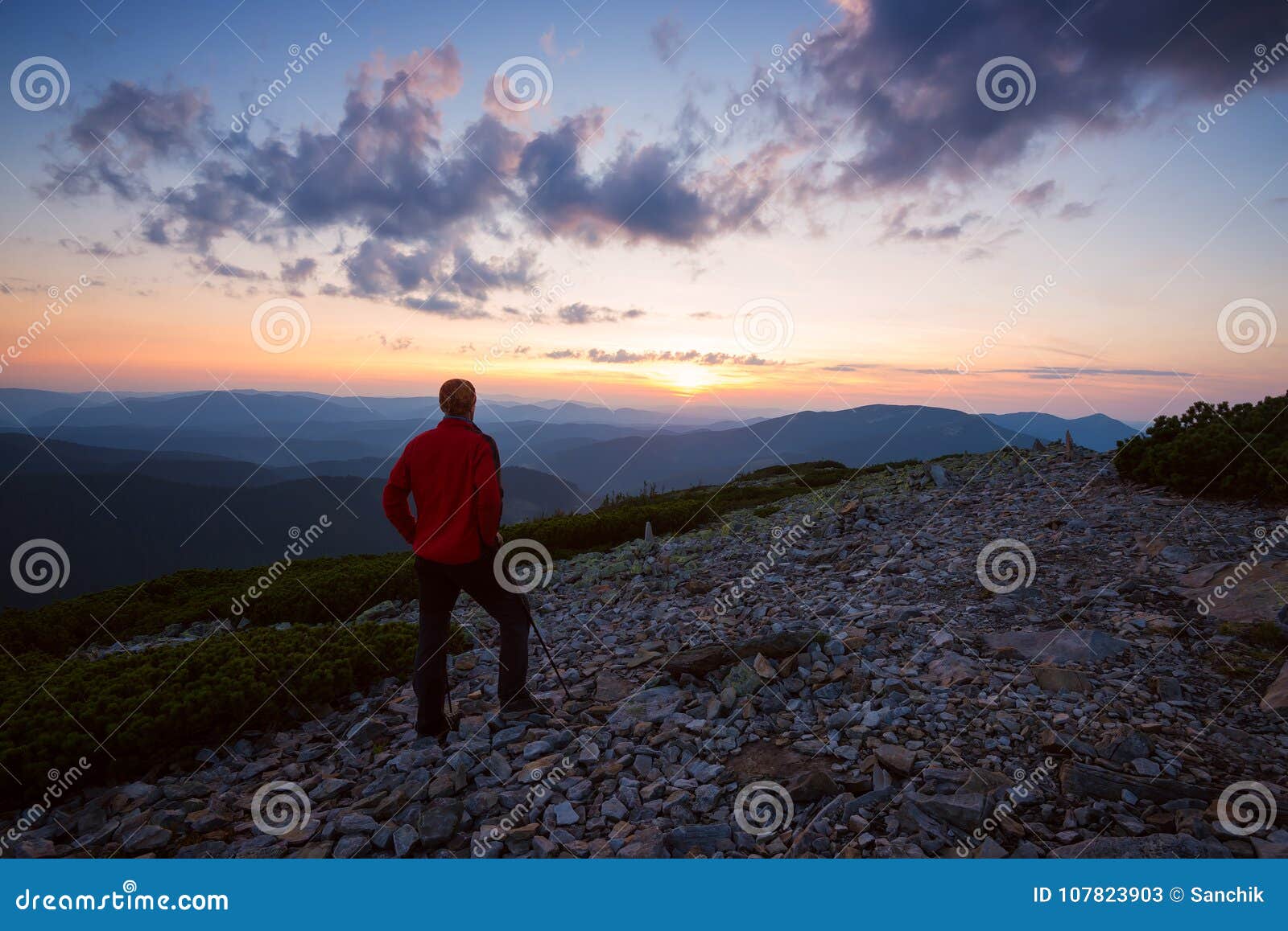Hiker watching sunset stock image. Image of nature, hiking - 107823903