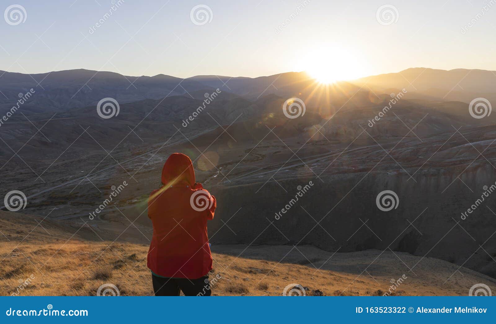 Hiker Watching the Sunset in the Mountains Stock Photo - Image of ...