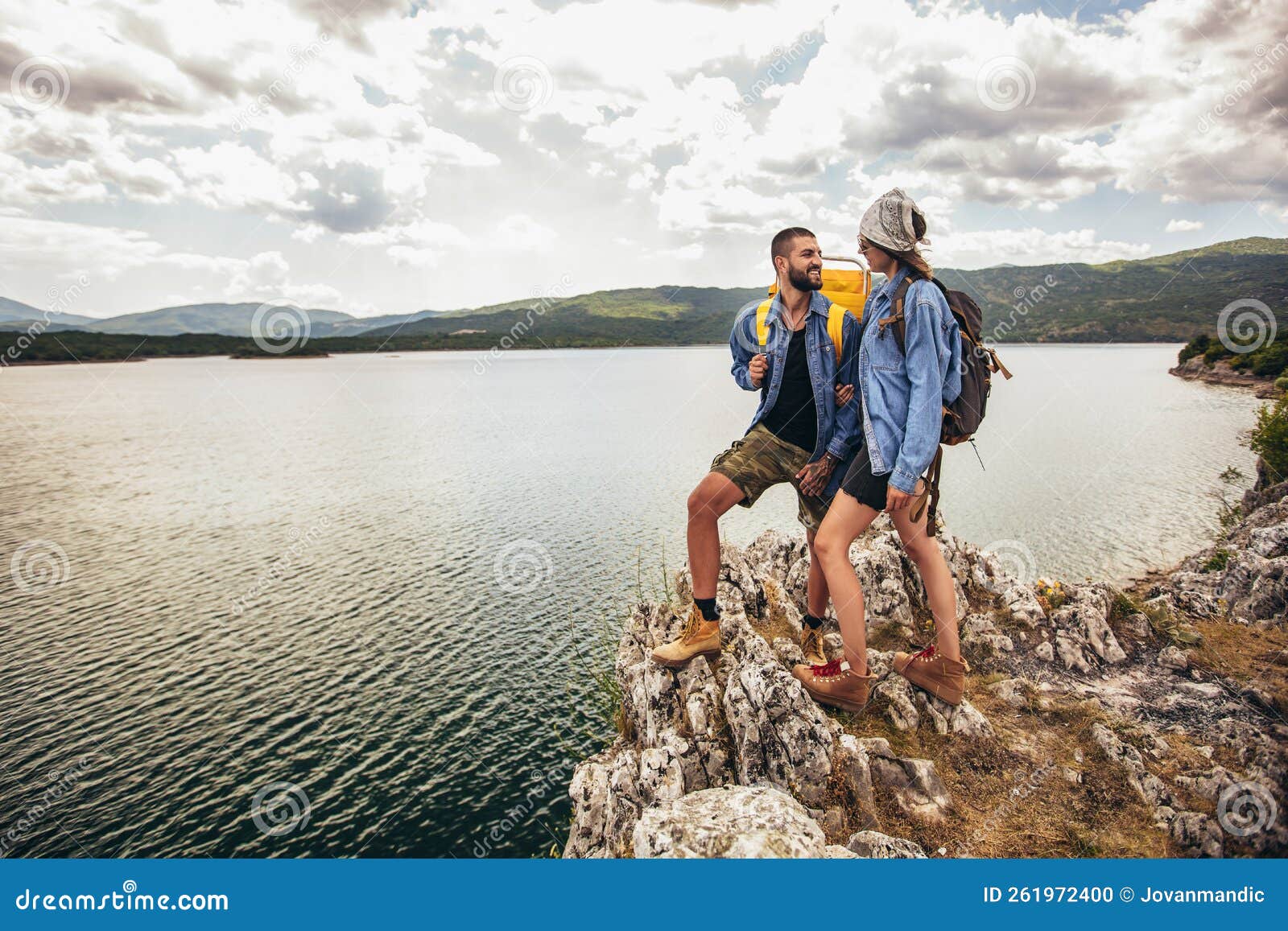 Hikers with Backpacks Walking Enjoying at the Mountain Lake Stock Photo ...