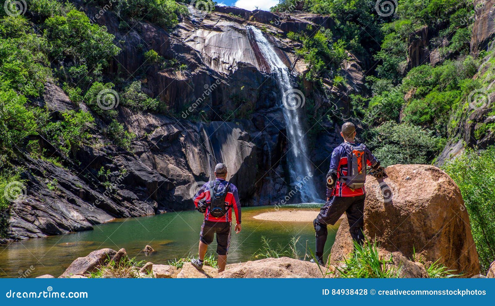 Hikers By Countryside Waterfall Picture. Image: 84938428