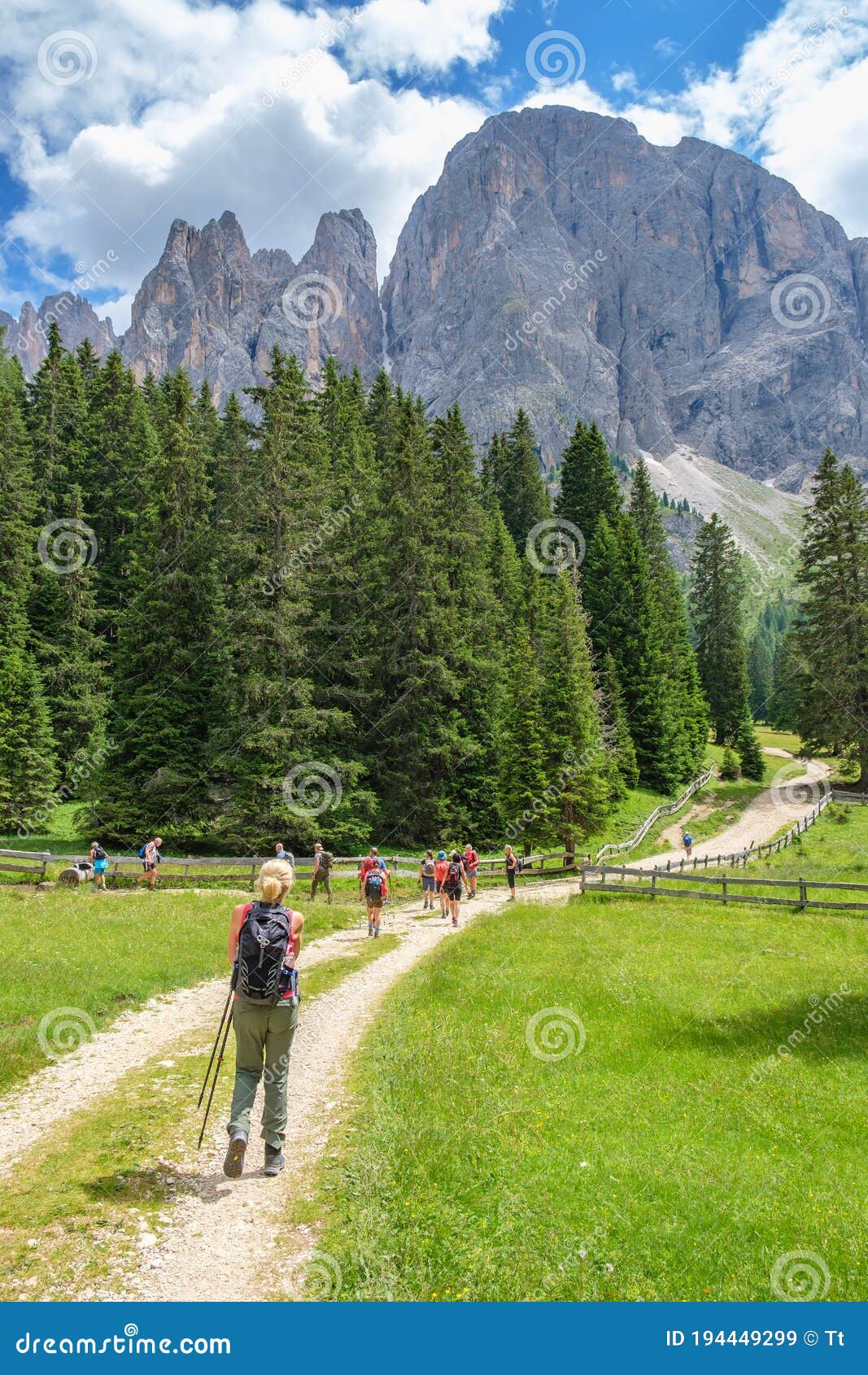 Hikers on a Trail at an Alpine Meadow with High Mountain Peaks ...