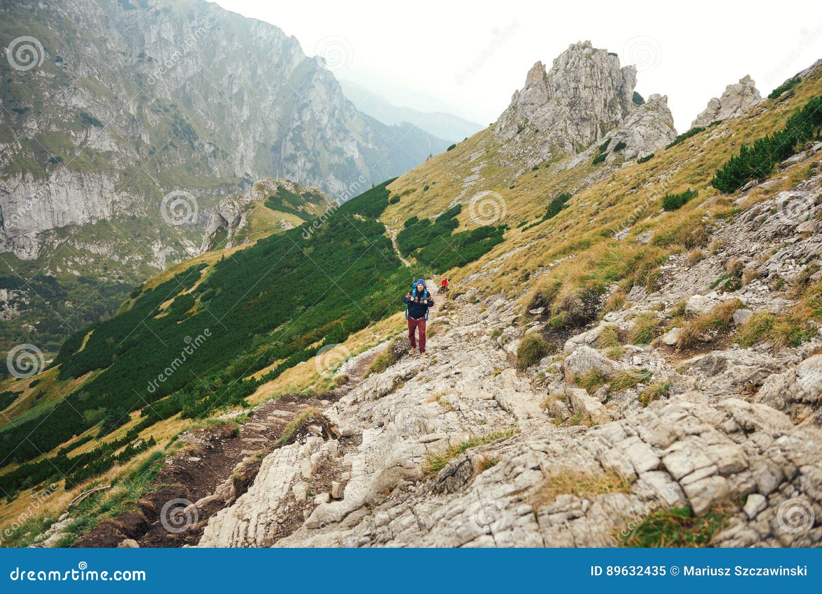 Hikers Walking Along a Trail in Rugged Mountain Terrain Stock Image ... Hikers Walking Along a Trail in Rugged Mountain Terrain Stock Image ...