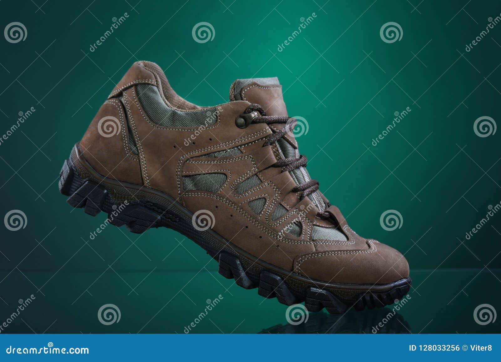 Hiking Boot on Green Background Stock Photo - Image of closeup, leather ...