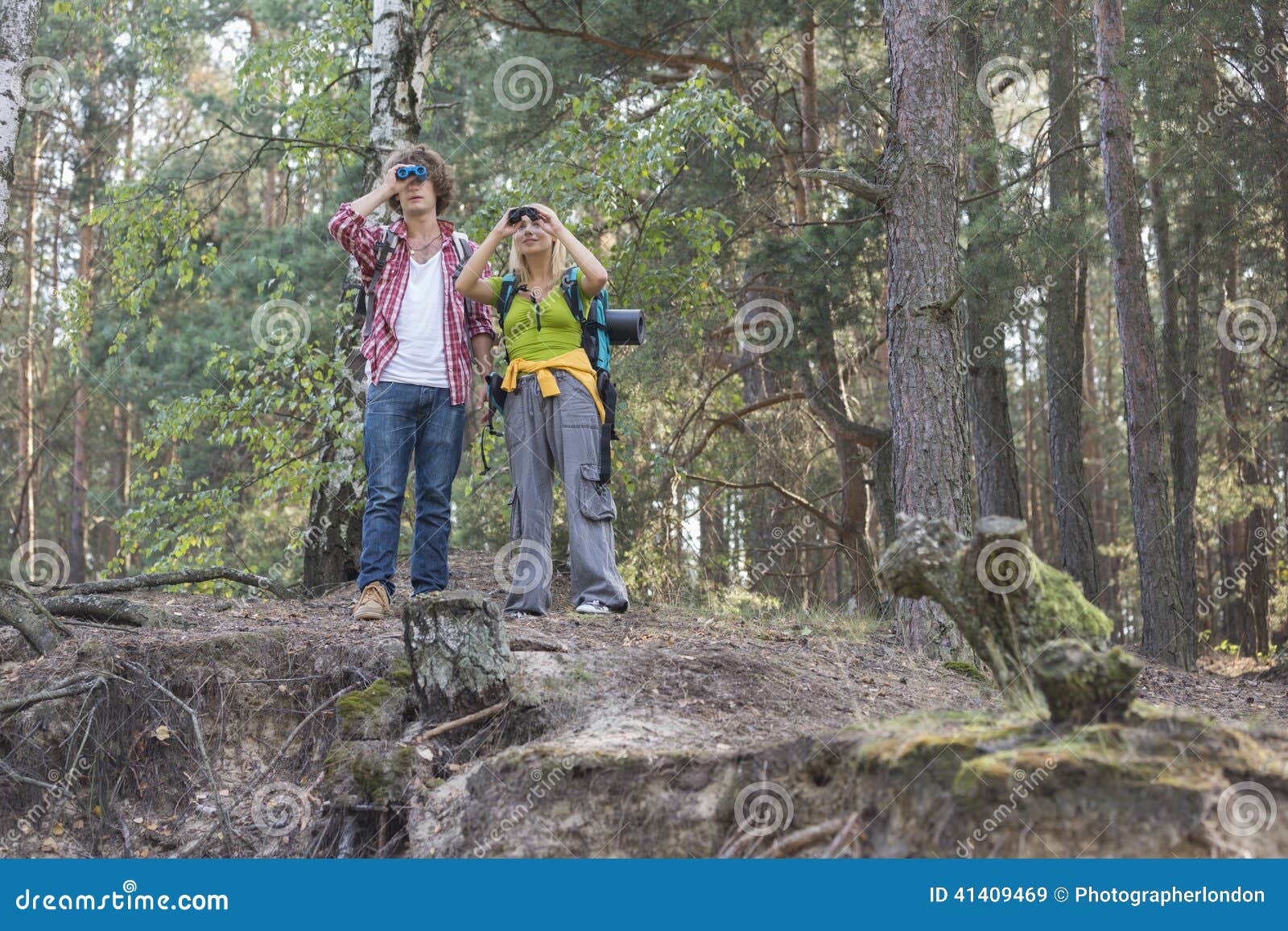 Hiking Couple Using Binoculars in Forest Stock Image - Image of front ...