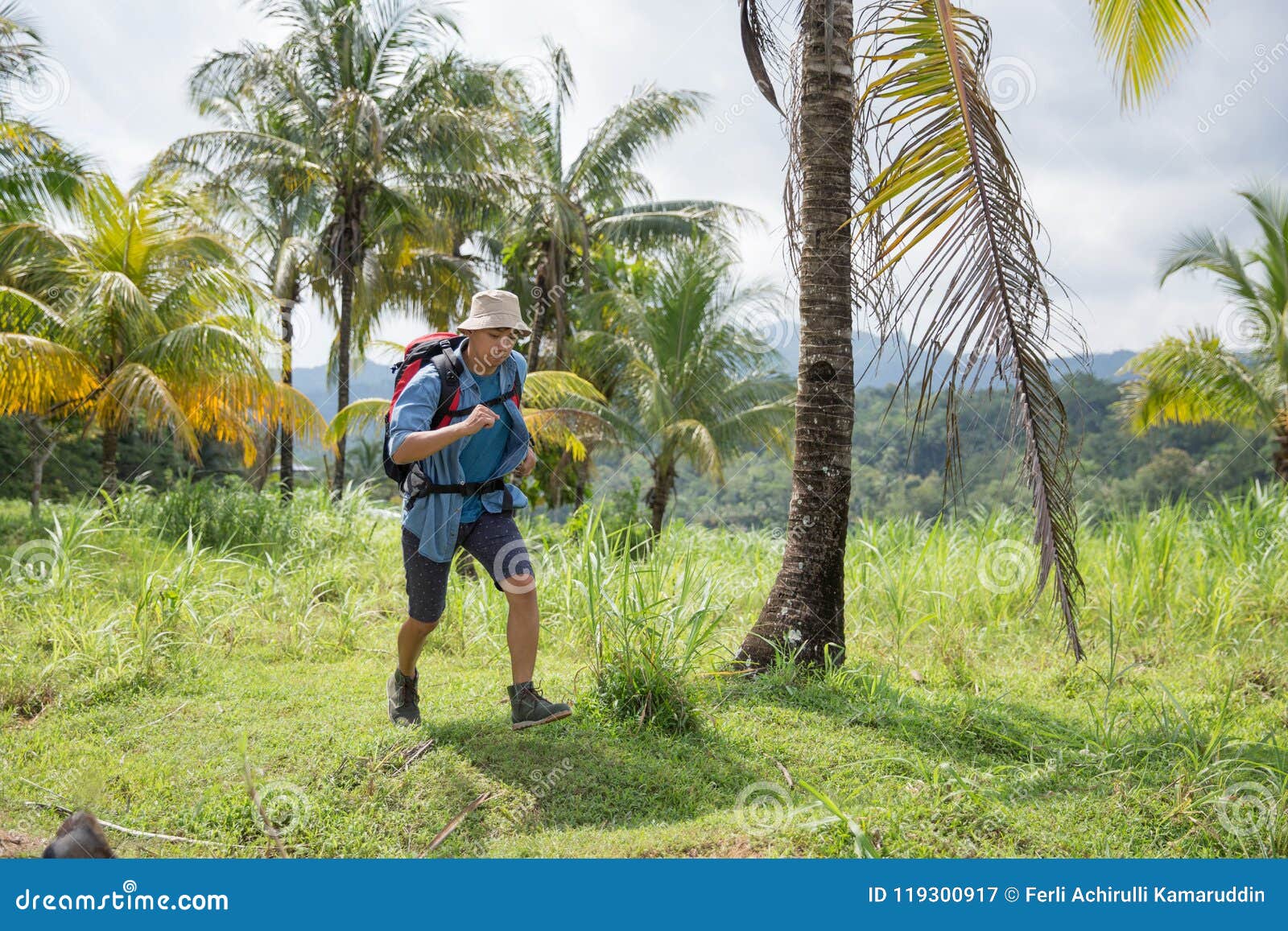 Man with backpack running stock image. Image of indonesian - 119300917