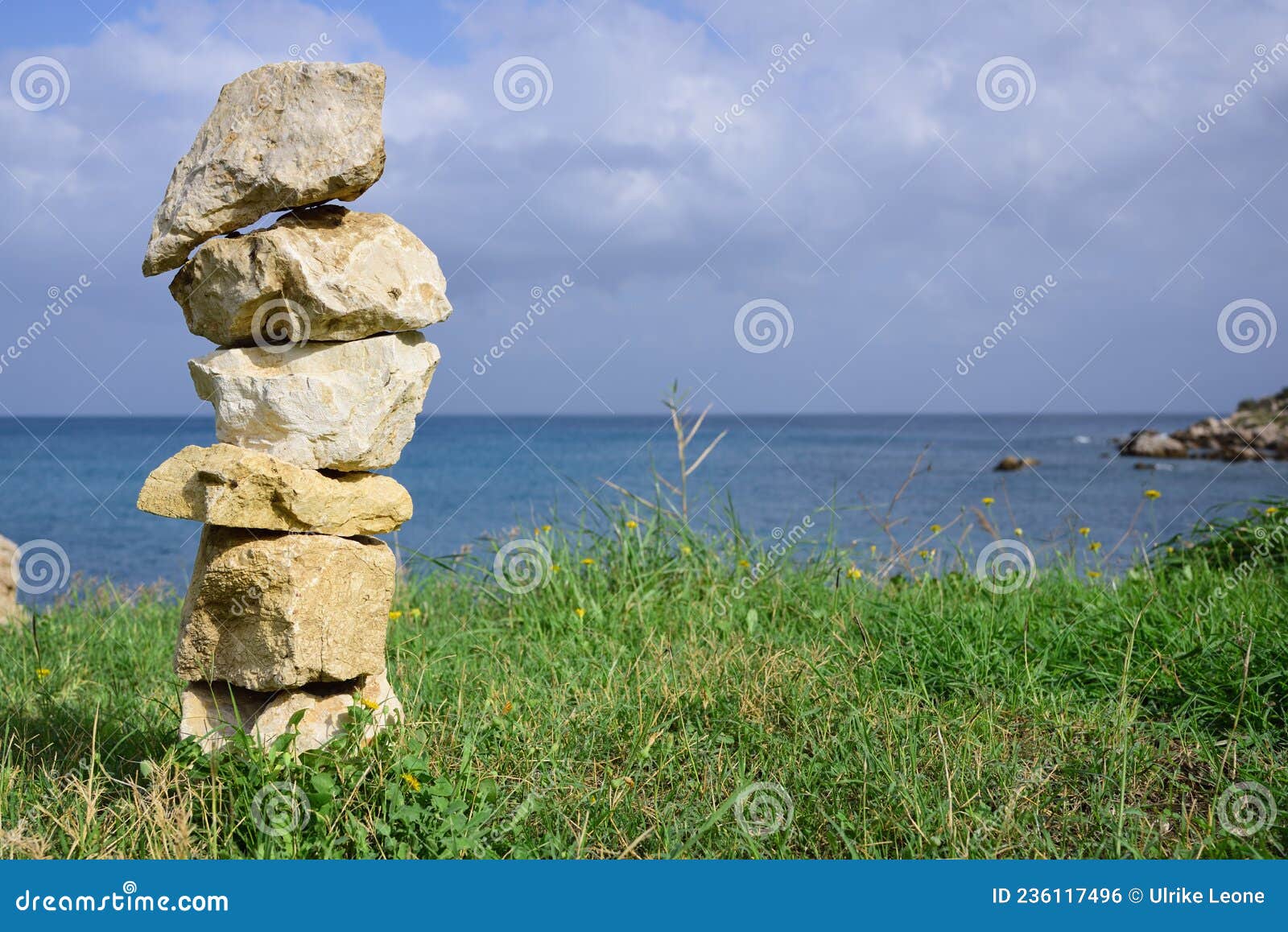 On a Hill on the Coast, Several Stones are Piled Up To Form a Tower and ...