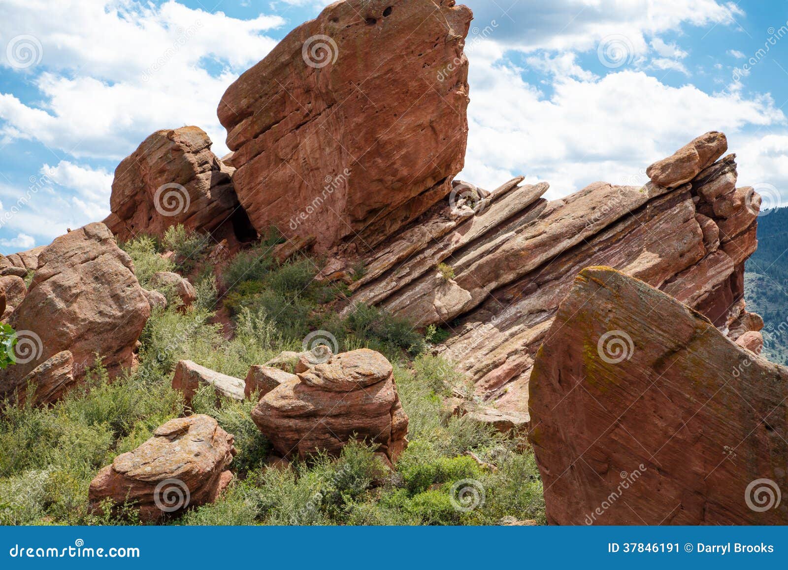 Hill of Grass and Red Rock Boulders Stock Image - Image of desert ...