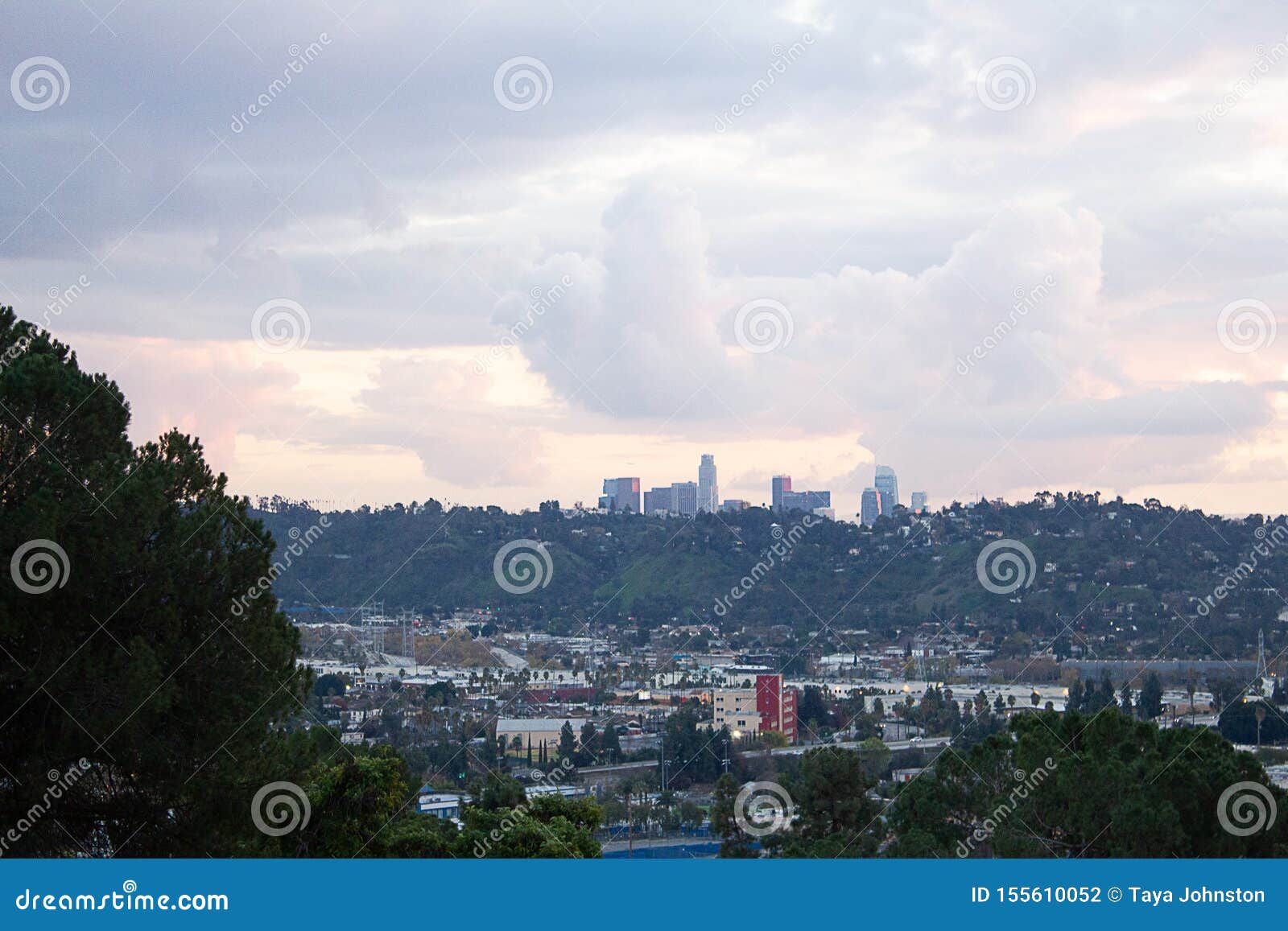 Hillside View of Homes and Streets with Panoramic Sky in Pink and ...