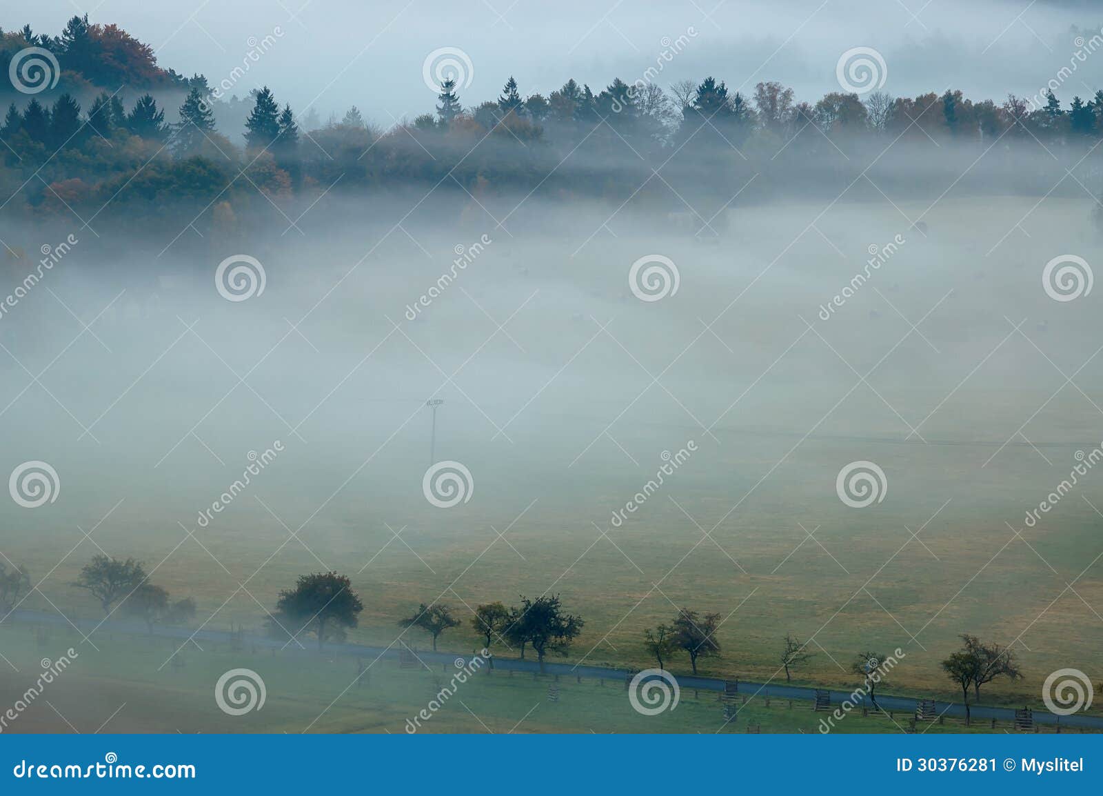 Hilly landscape with fog stock image. Image of foggy - 30376281