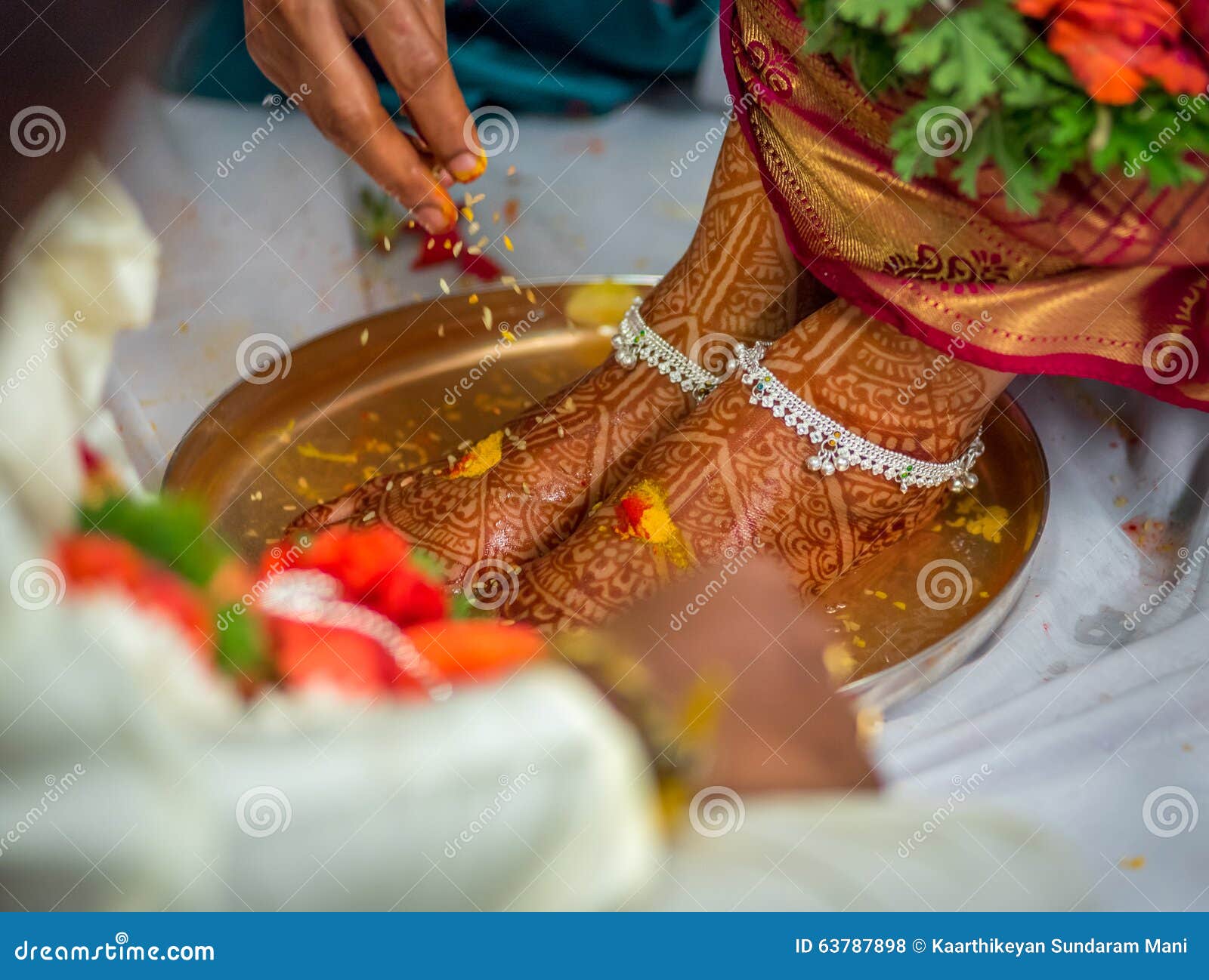 Closeup Of Decorated Feet Of An Indian Bride While A Traditional Ritual