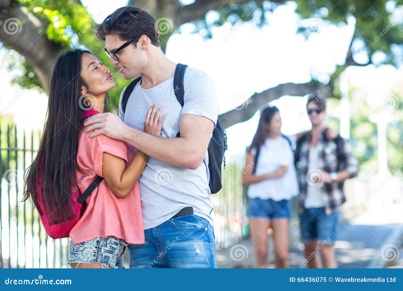 Hip couple about to kiss stock image. Image of friend - 66436075