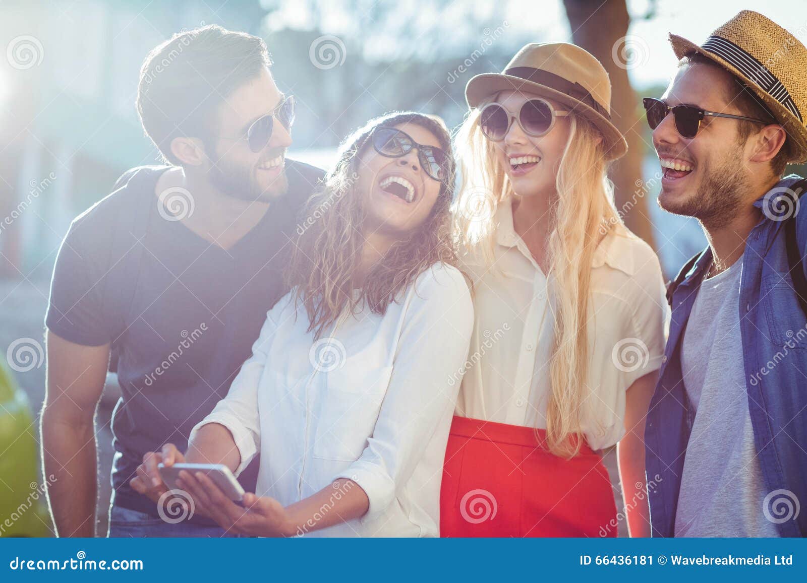 Hip Friends Checking at Smartphone Stock Image - Image of enjoying ...