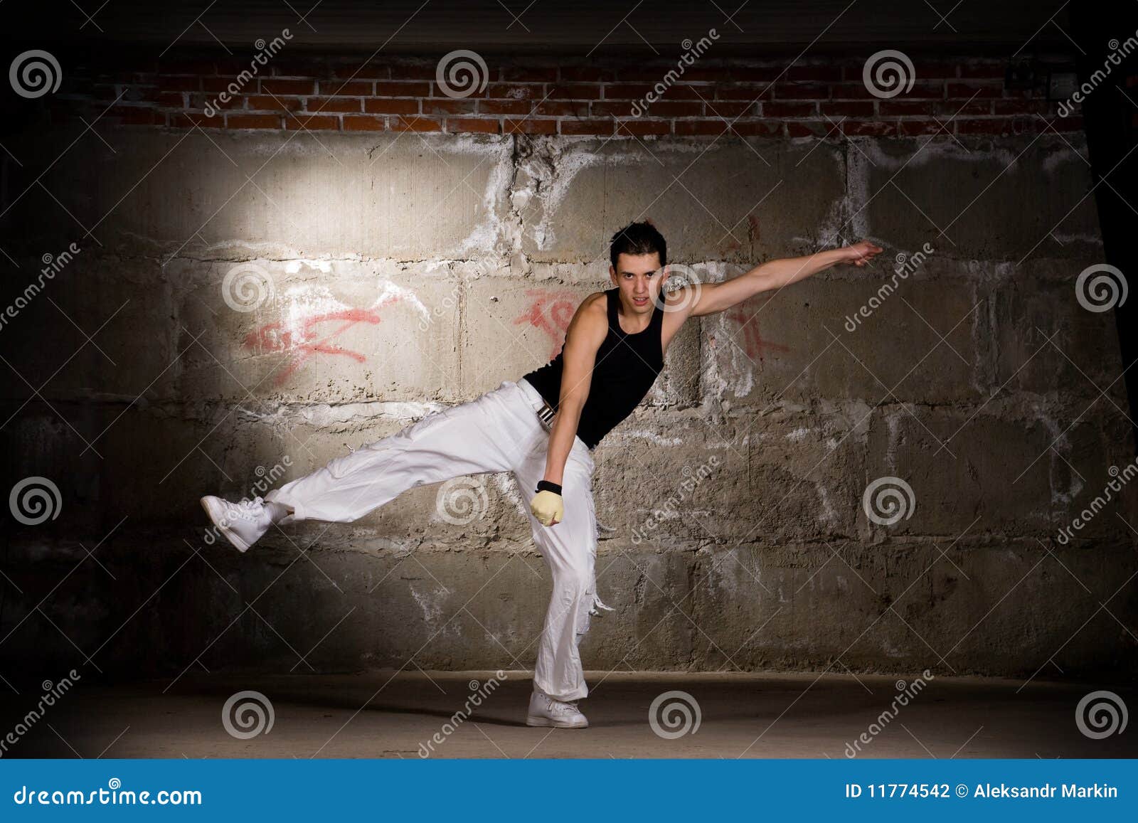 Hip Hop Boy Dancing in Modern Style Over Grey Wall Stock Photo - Image ...
