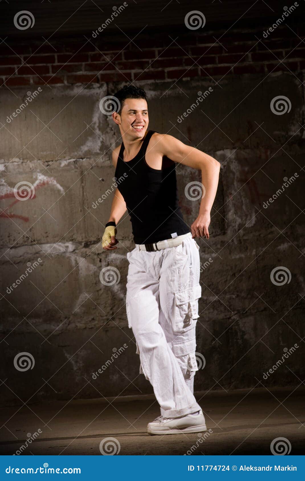 Hip Hop Boy Dancing in Modern Style Over Grey Wall Stock Photo - Image ...