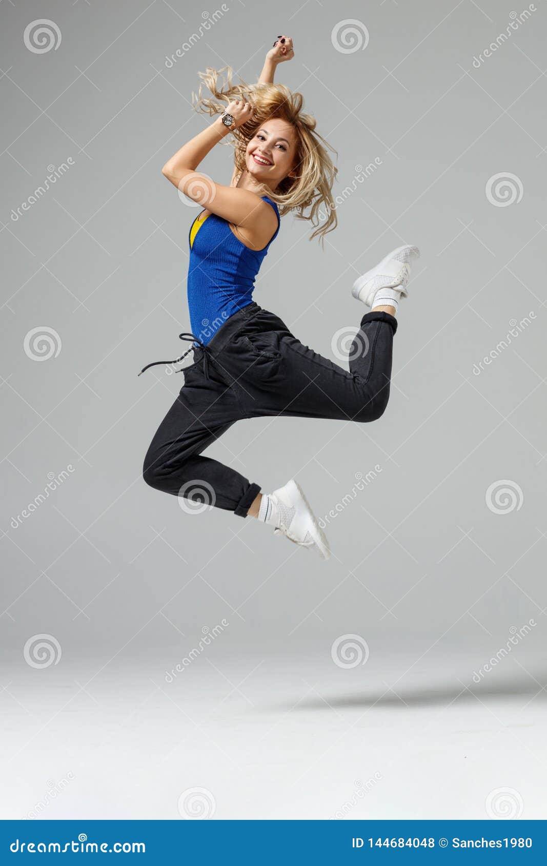 Hip Hop Dancer Moving and Jumping in Studio Stock Photo - Image of ...