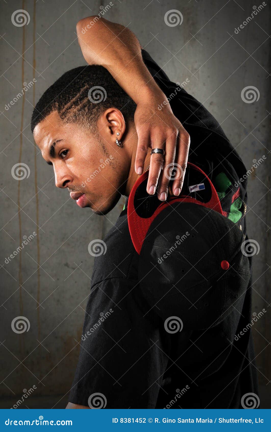 Hip Hop Man Holding Hat stock photo. Image of male, face - 8381452