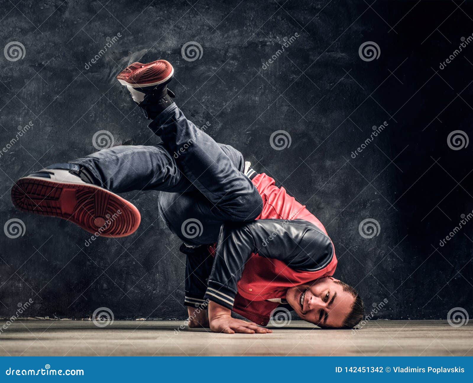 Hip-hop Style Dancer Performs Breakdance Acrobatic Elements. Stock ...