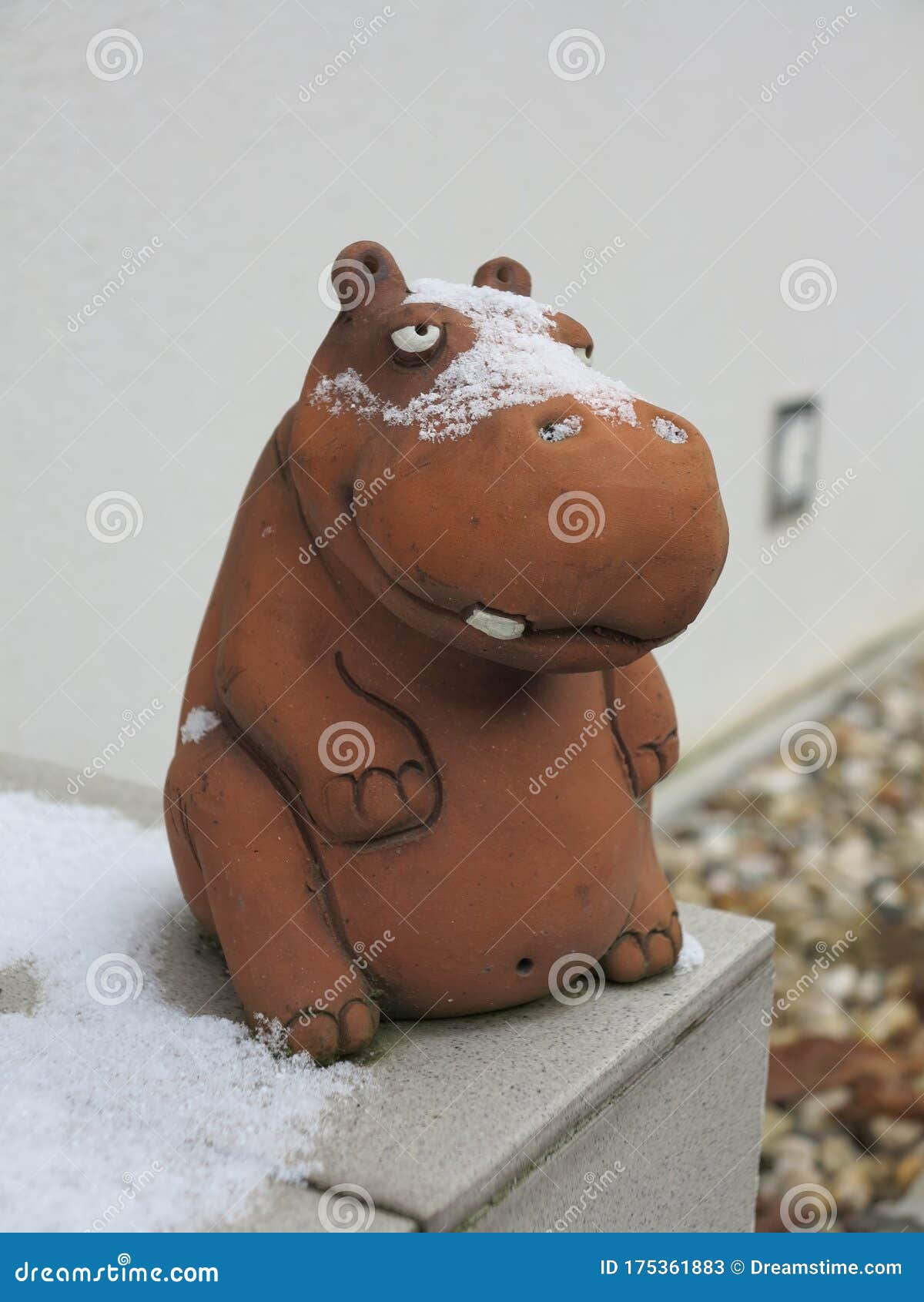 Hippopotamus Made of Clay Standing on a Step Covered with Snow. Stock ...