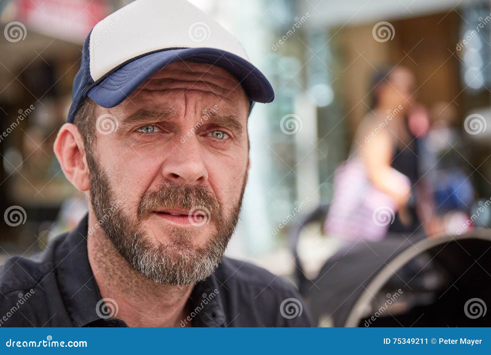 Hipster with Beard and Baseball Cap Sitting in a Street Cafe Stock ...