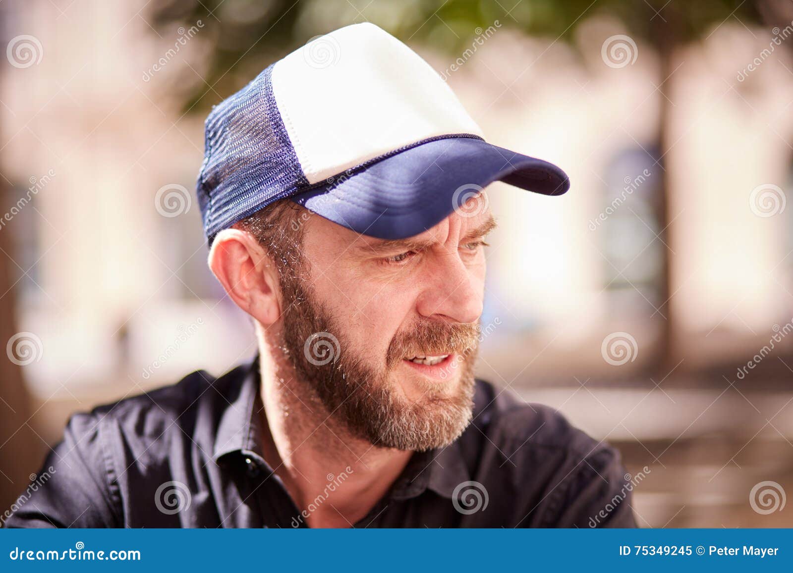 Hipster with Beard and Baseball Cap Sitting in a Street Cafe Stock ...