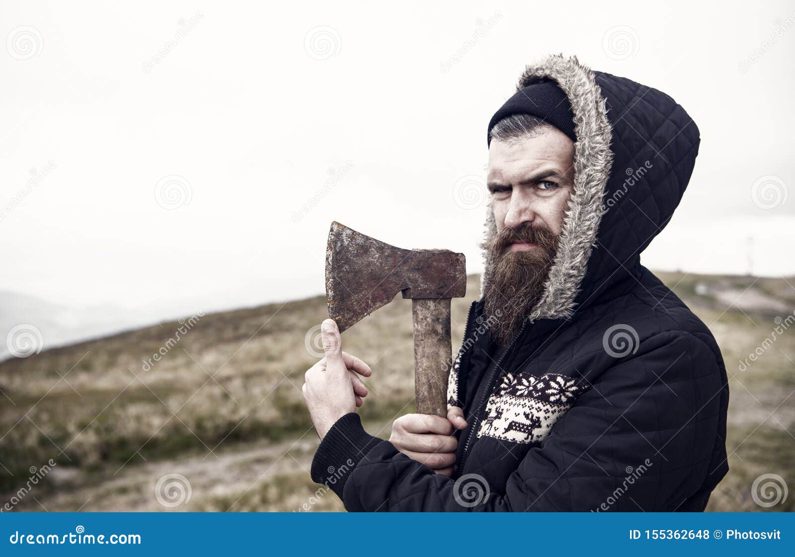 Lumberjack With Strict Look And Long Bushy Beard Whetting Razor Or ...