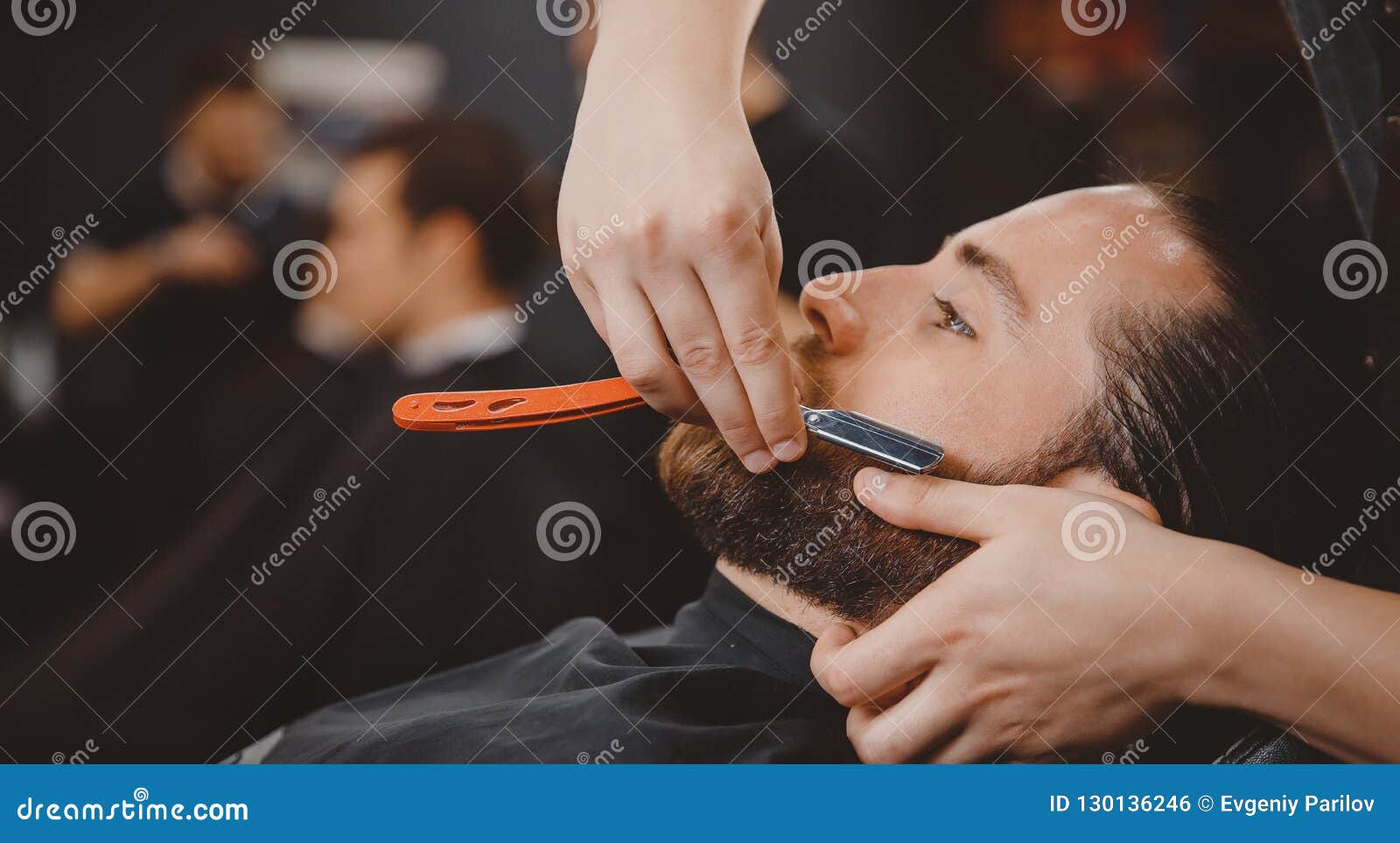Razor in hands of barber stock photo. Image of masculine - 130136246