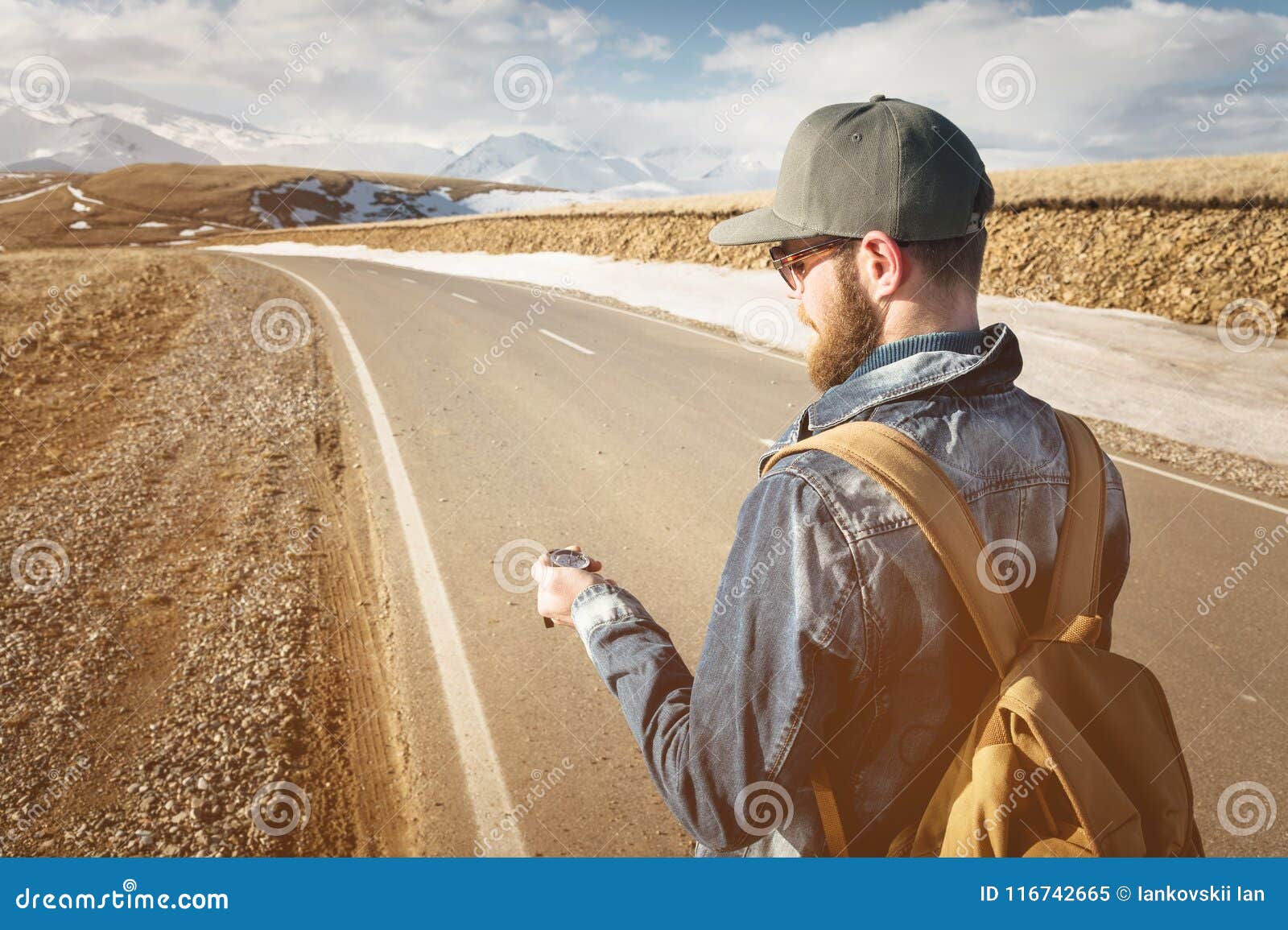 Hipster Man Using a Compass on a Snowy Mountain Stock Image - Image of ...