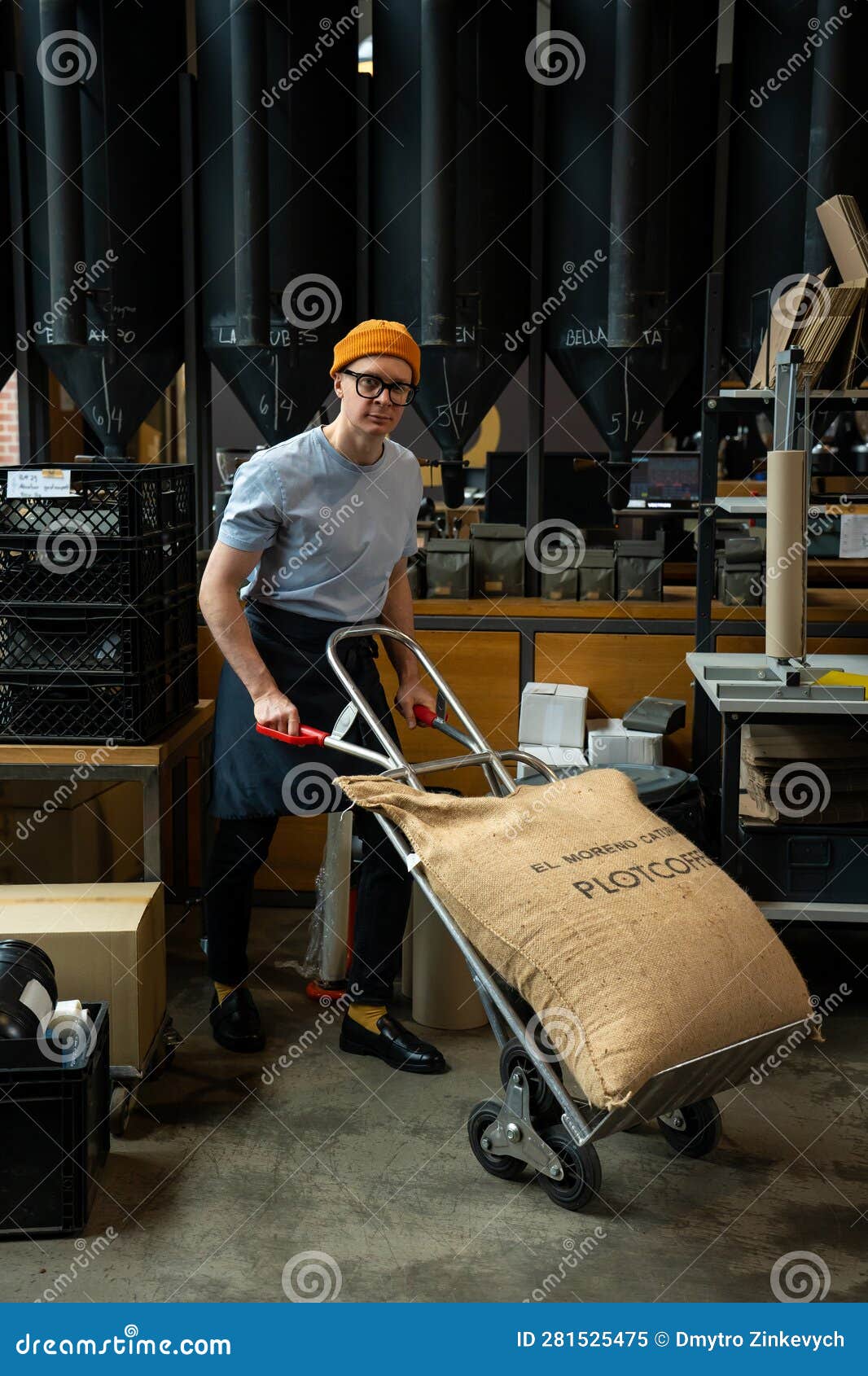 Roastery Worker Standing with Sacks with Coffee Beans Uploading. Stock ...