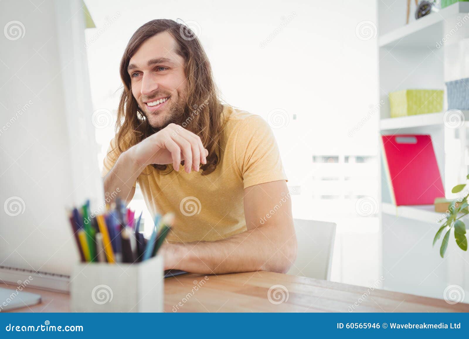 Hipster Smiling while Working at Computer Desk Stock Photo - Image of ...