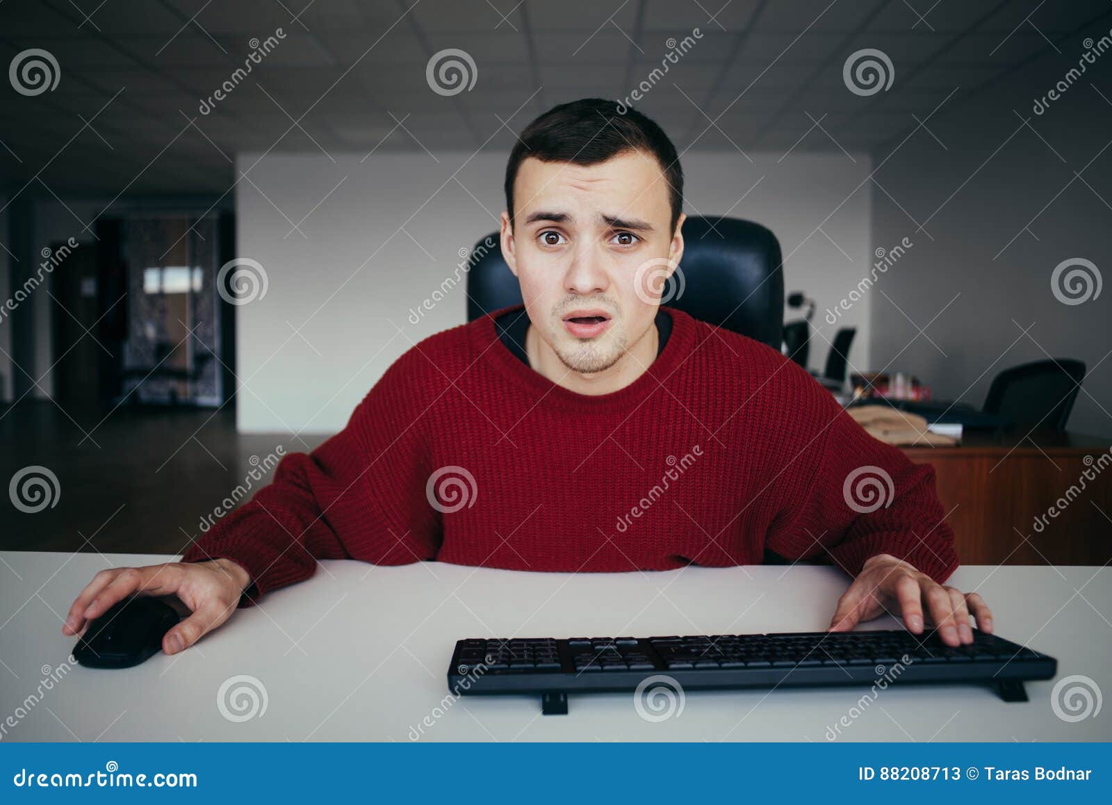 Hipster Young Man Working in the Office Puzzled Looks at the Monitor of ...
